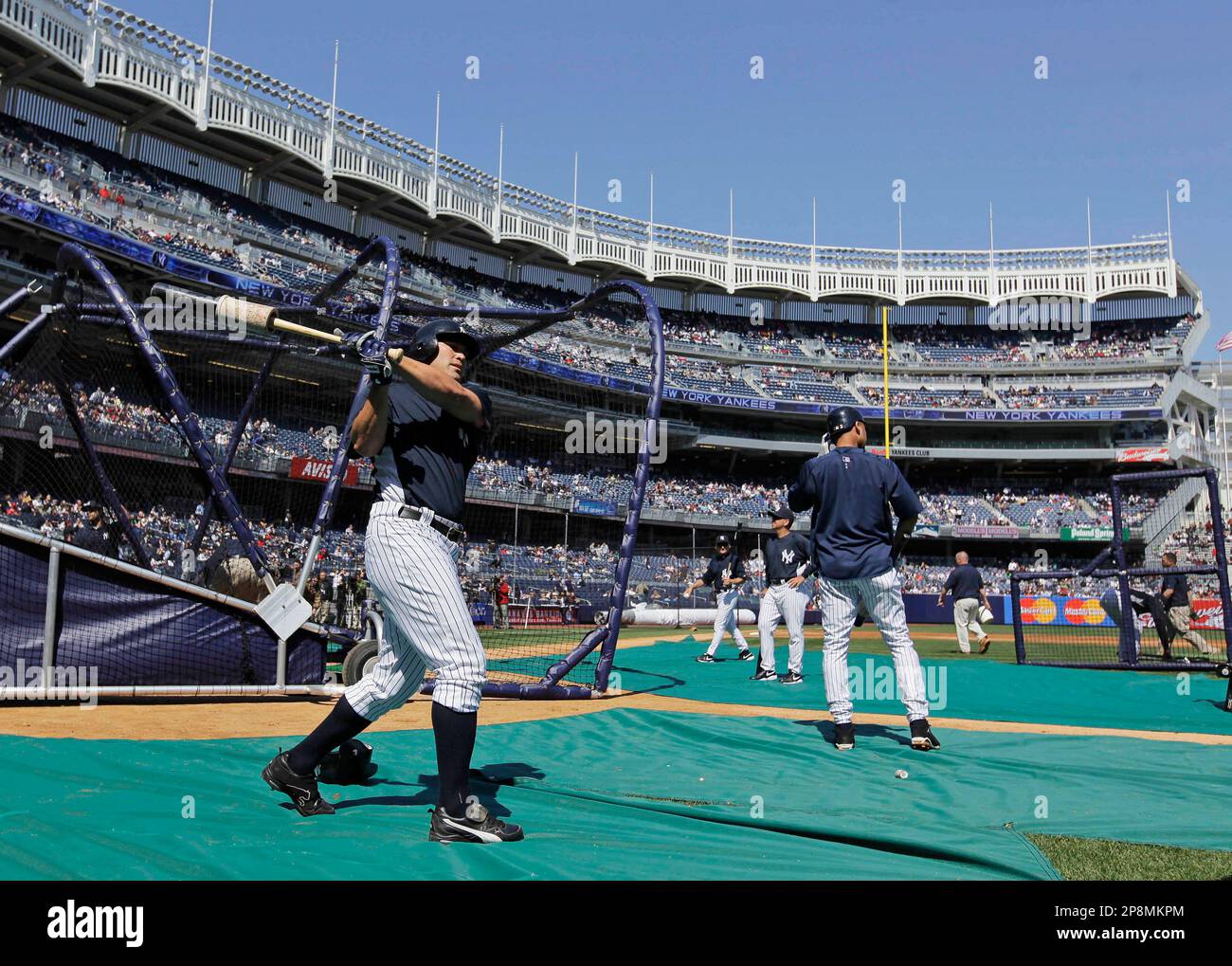 New York Yankees' Johnny Damon takes a practice swing before taking ...