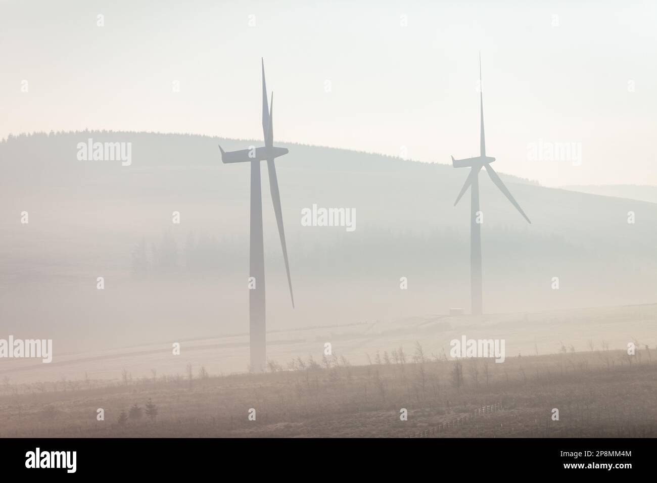 Two wind turbines in mist in the Scottish Borders Stock Photo - Alamy