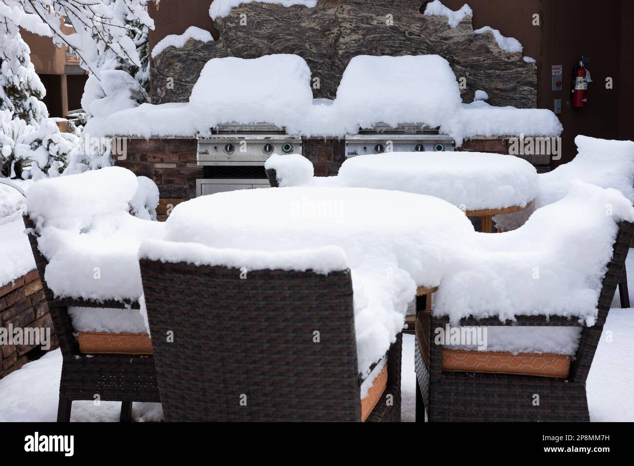 Patio table and charirs buried in deep snow after a rare snow storm in ...