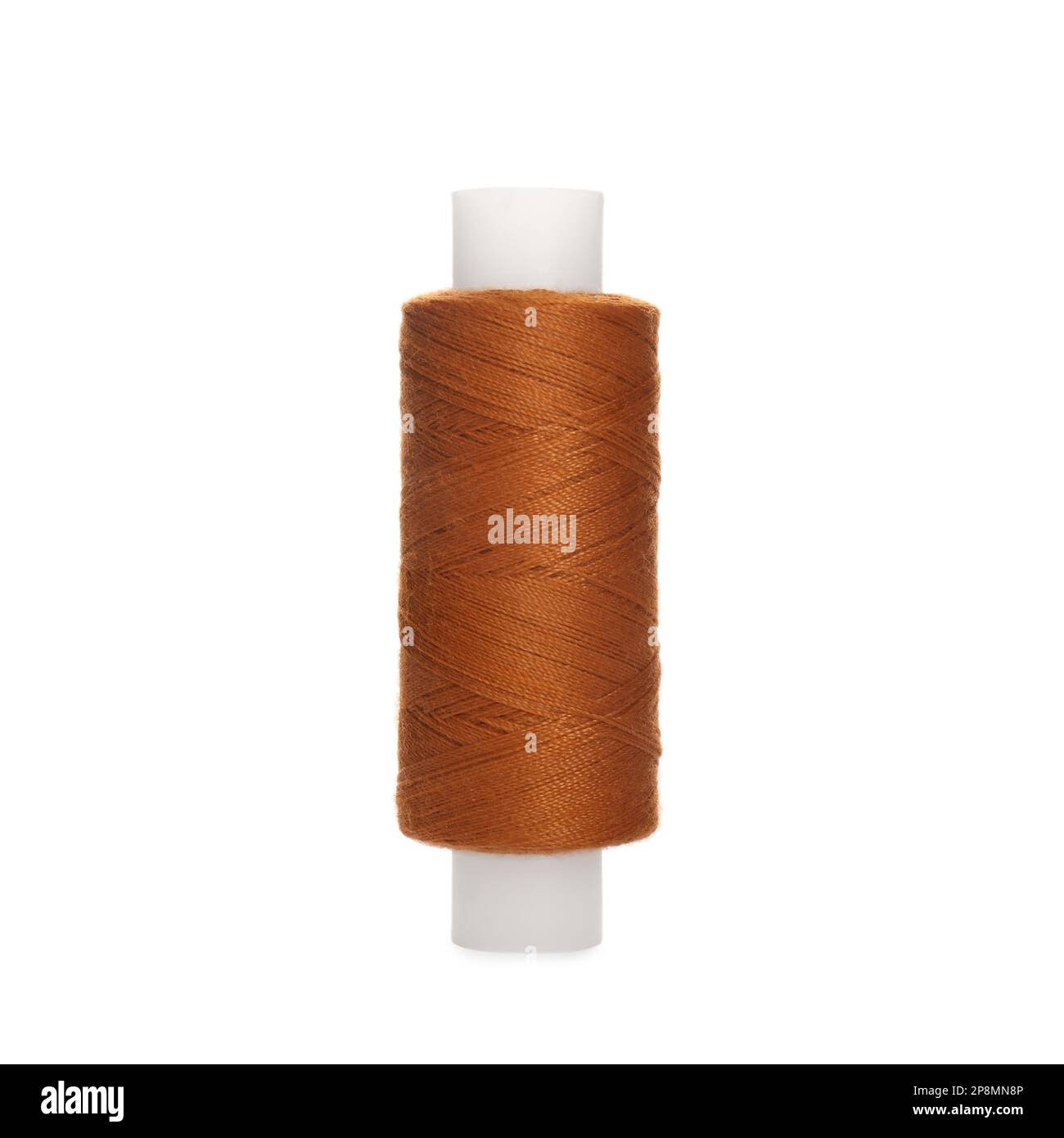 Spool of dark orange sewing thread isolated on white Stock Photo - Alamy
