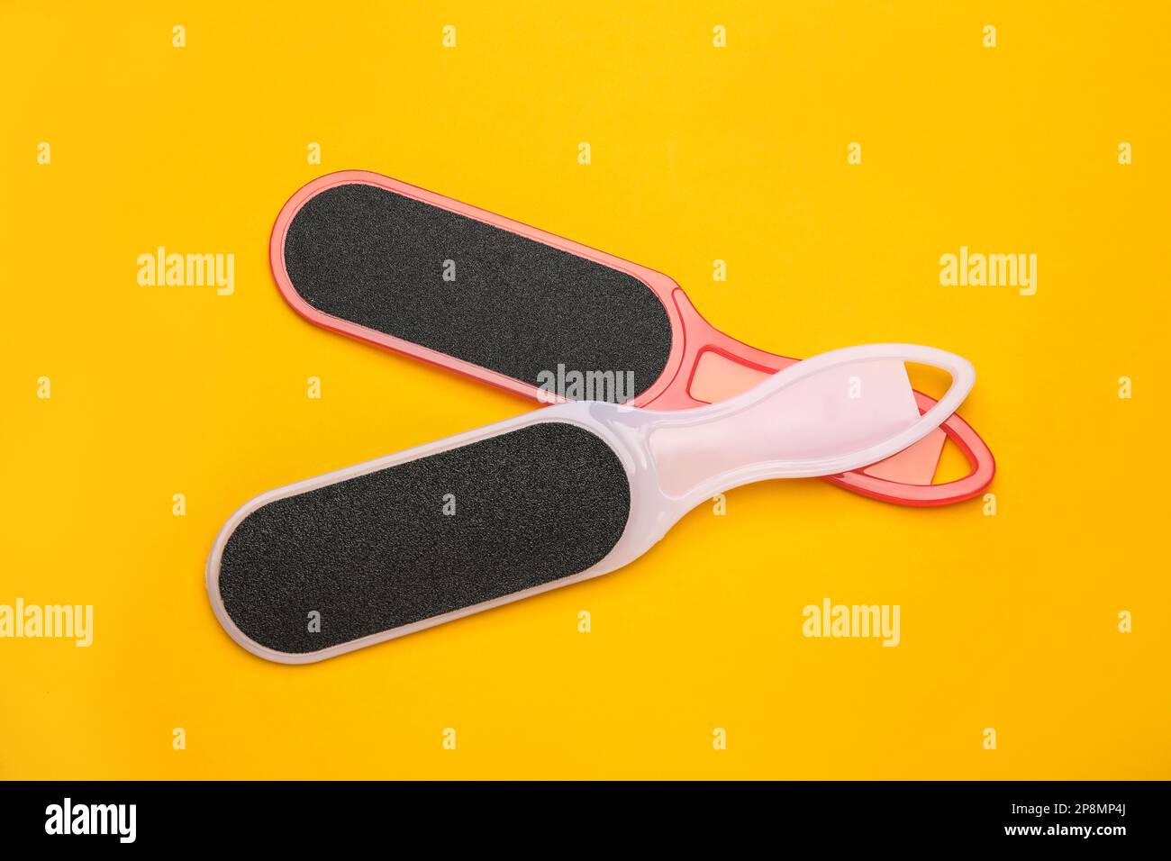Foot files on orange background, flat lay. Pedicure tools Stock Photo ...