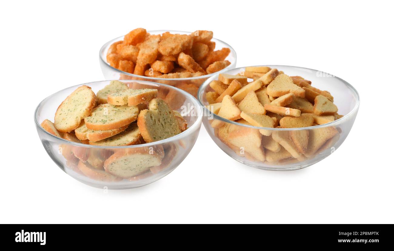 Different crispy rusks in bowls on white background Stock Photo - Alamy