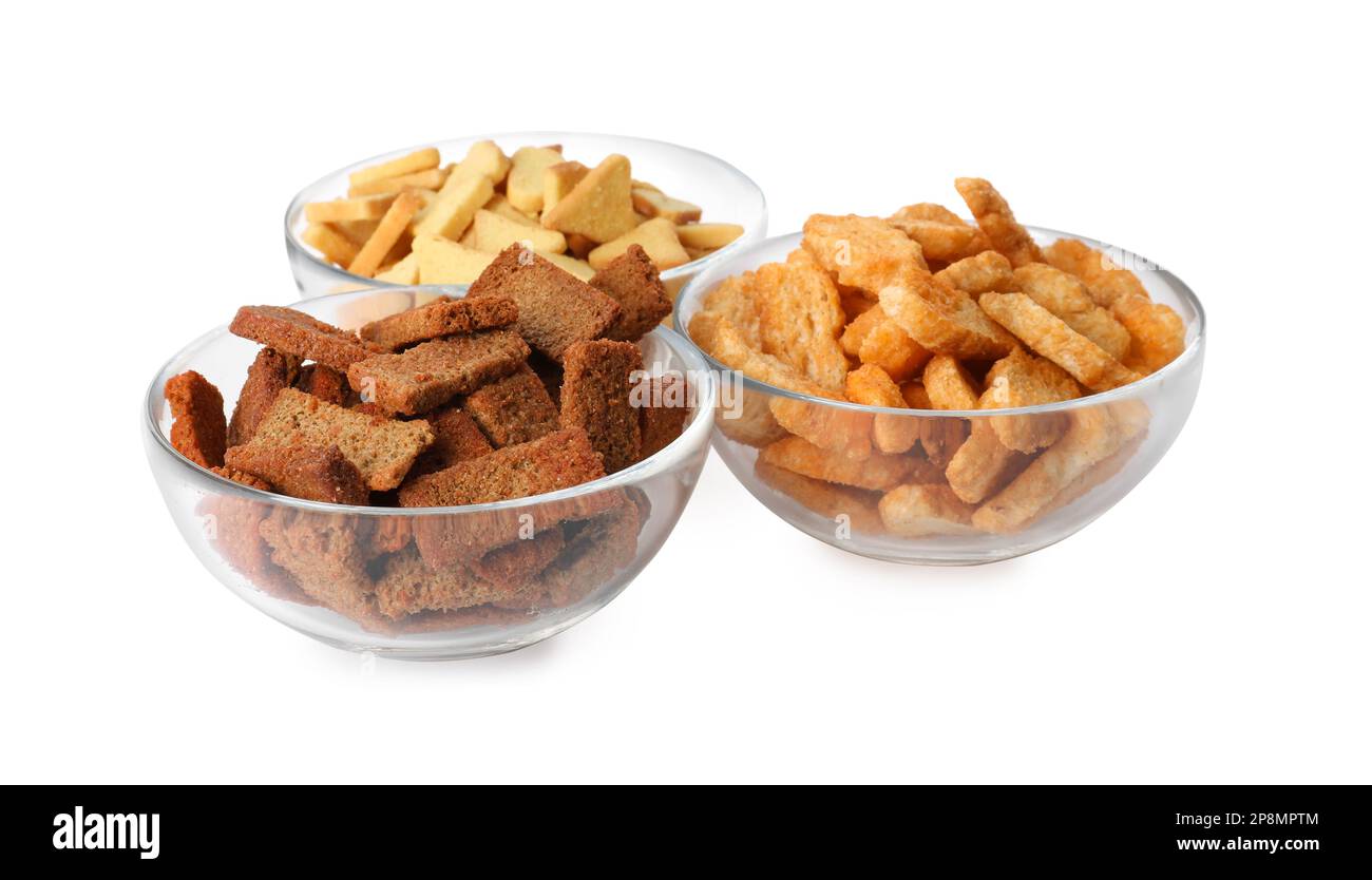 Different crispy rusks in bowls on white background Stock Photo - Alamy