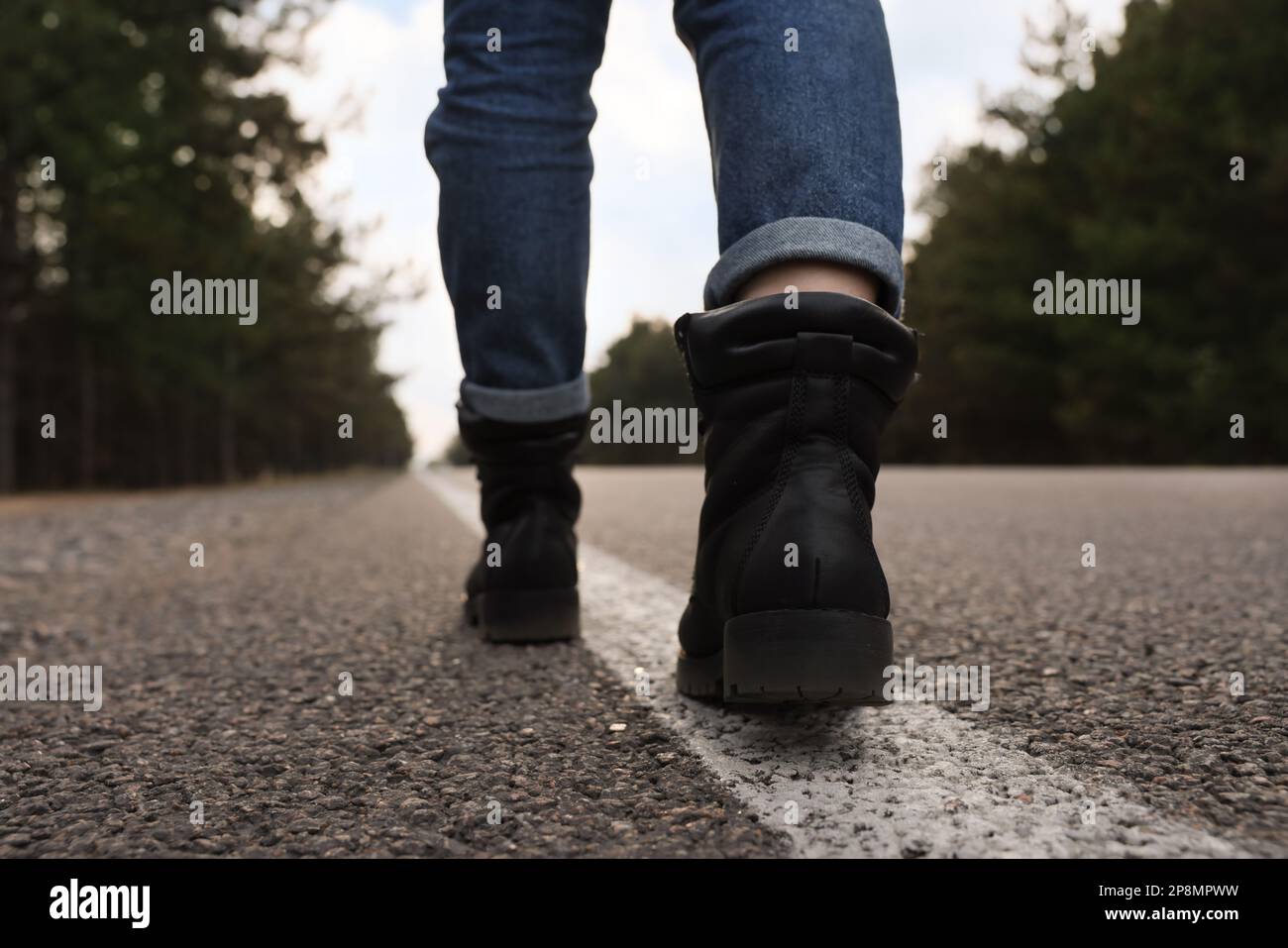 Woman going along road, closeup of legs Stock Photo - Alamy