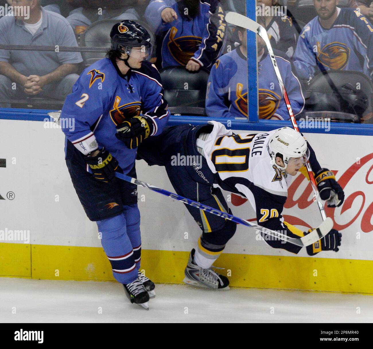 Atlanta Thrashers' Garnet Exelby (2) checks Buffalo Sabres' Daniel ...