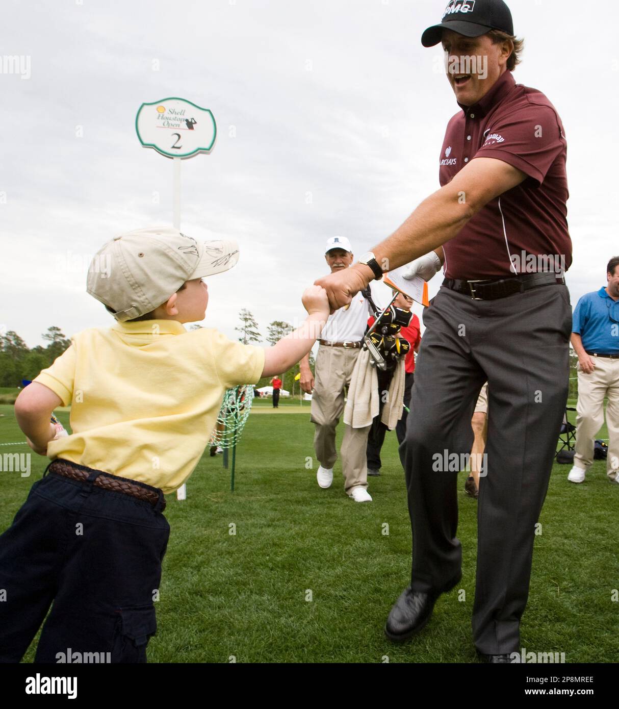 Colin Doran, 4, left, of Tomball, Texas, bumps fists with Phil ...
