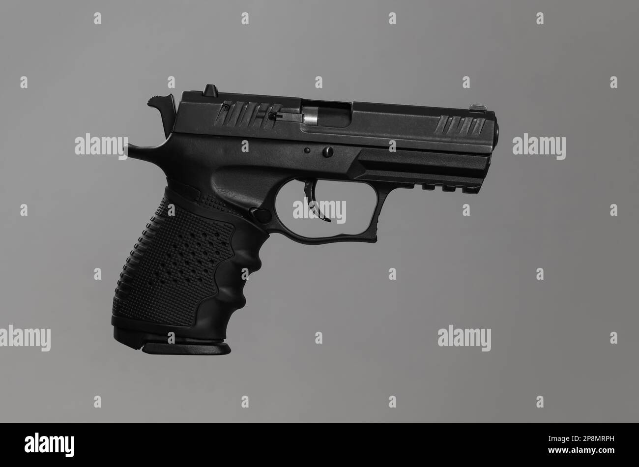 Standard handgun on light grey background. Semi-automatic pistol Stock ...