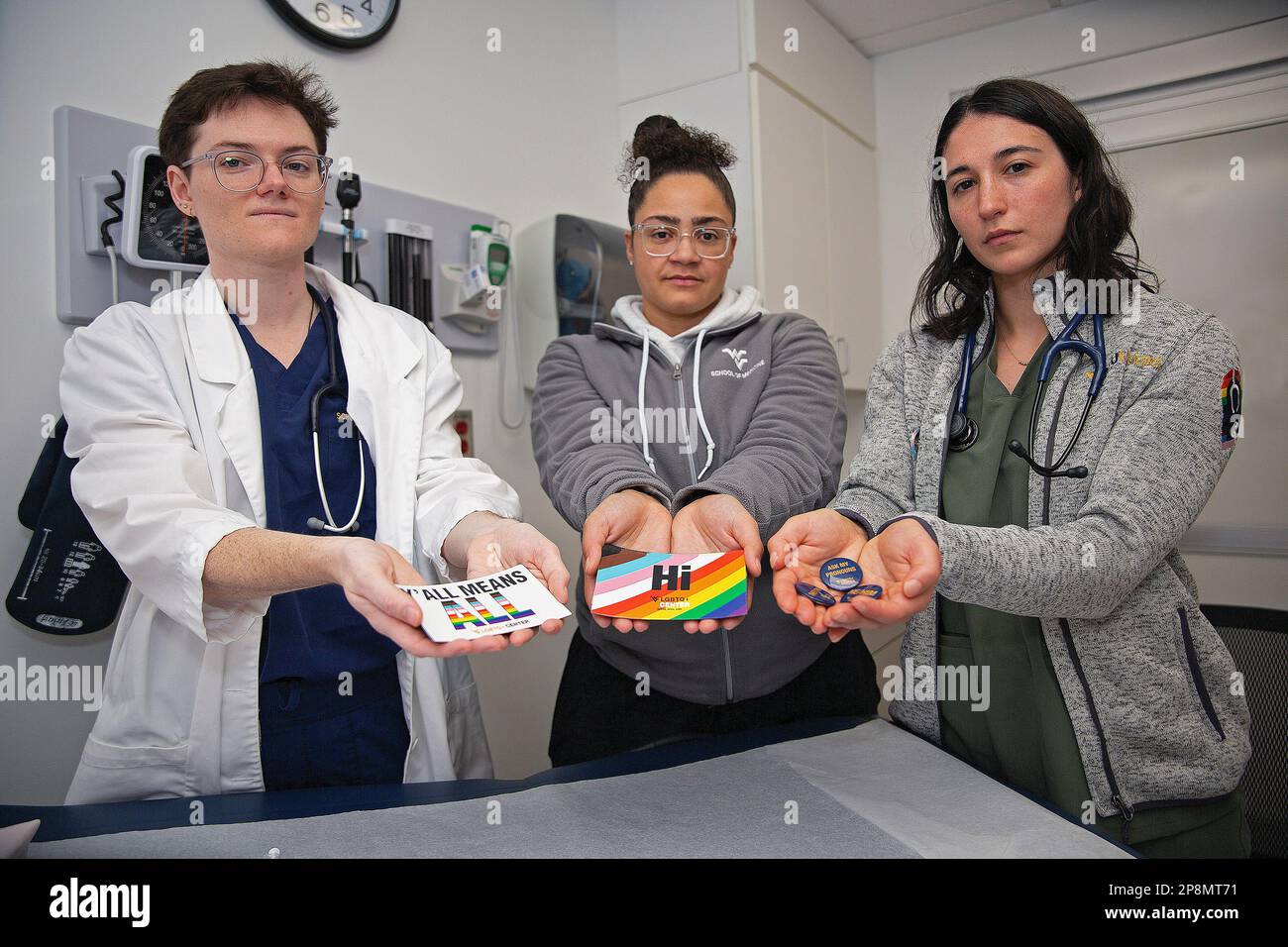 West Virginia University students El Didden, Bri Caison and Lia Farrell hold materials from the ...