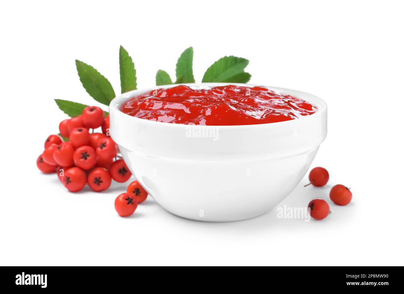 Delicious rowan jam in ceramic bowl and berries on white background ...