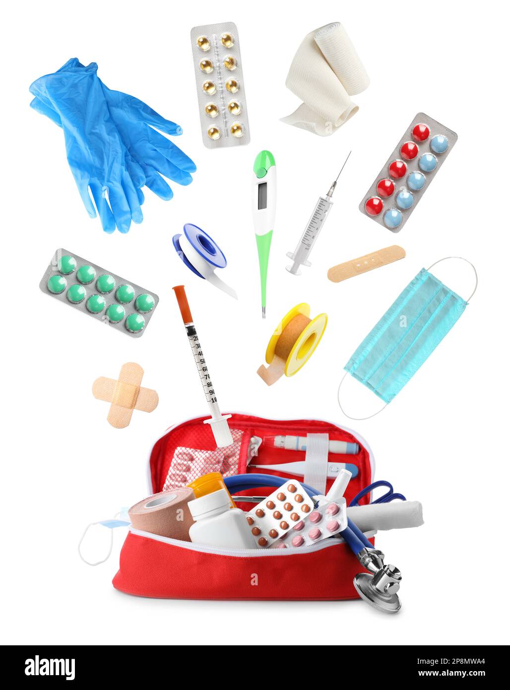 First aid kit. Different medical supplies falling on white background ...