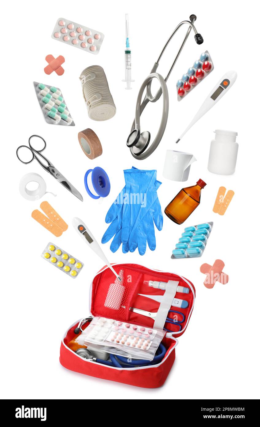 First aid kit. Different medical supplies falling on white background ...