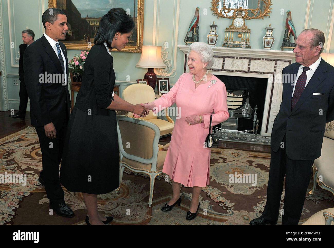 US President Barack Obama and his wife Michelle, are welcomed by ...