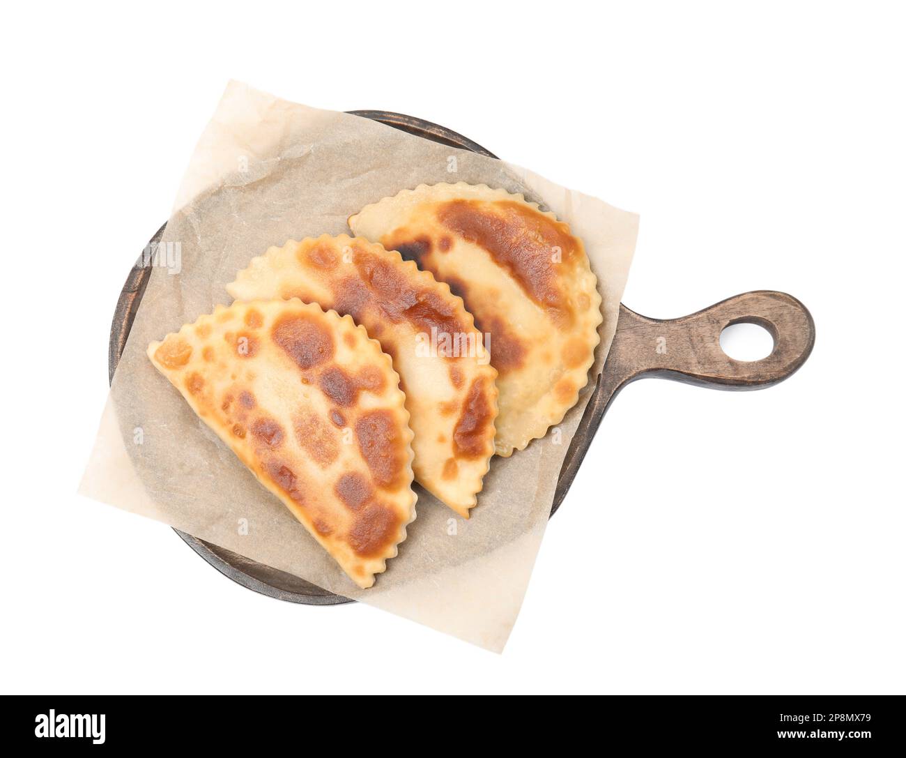Wooden board with delicious fried chebureki isolated on white, top view ...