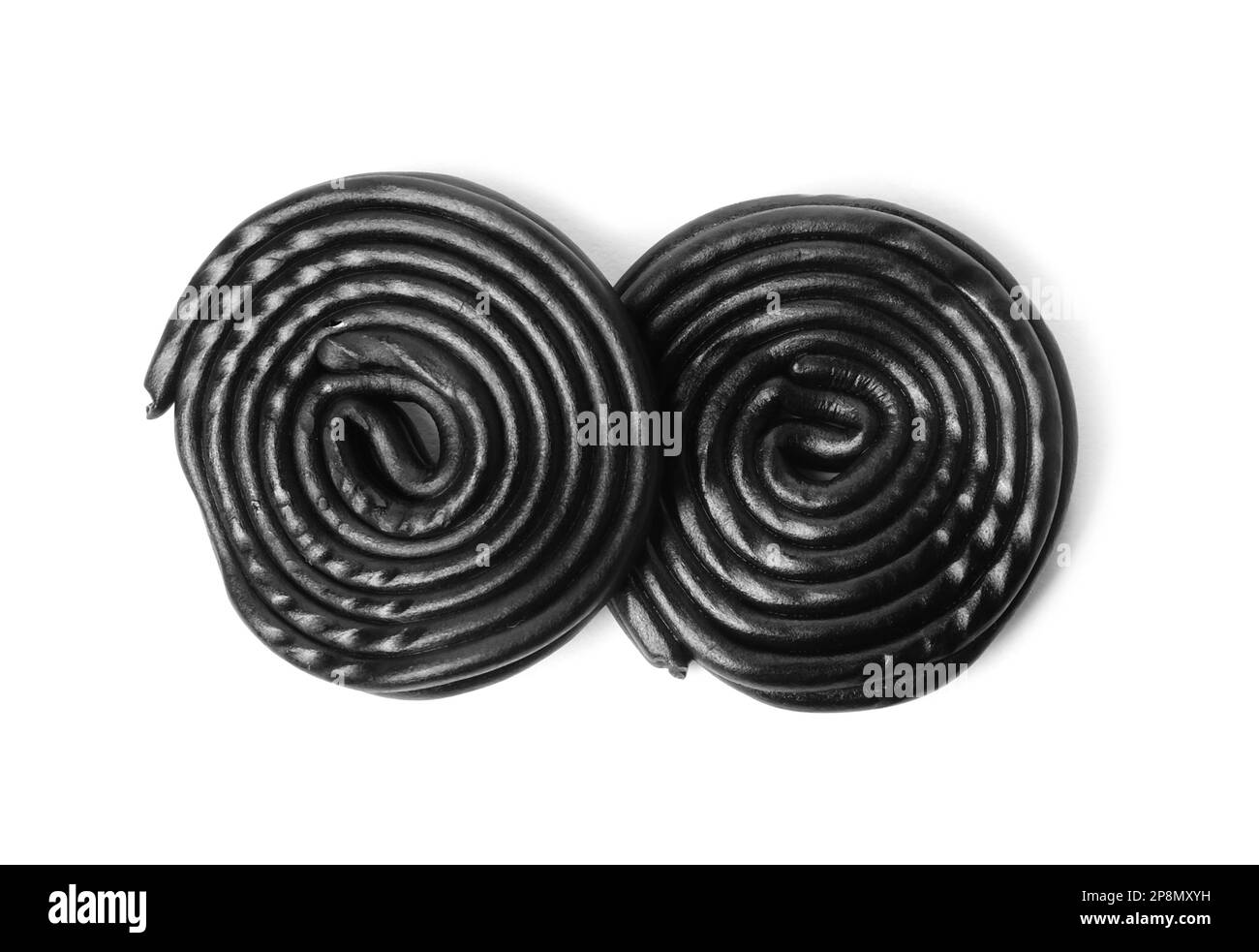 Tasty black liquorice candies on white background, top view Stock Photo ...