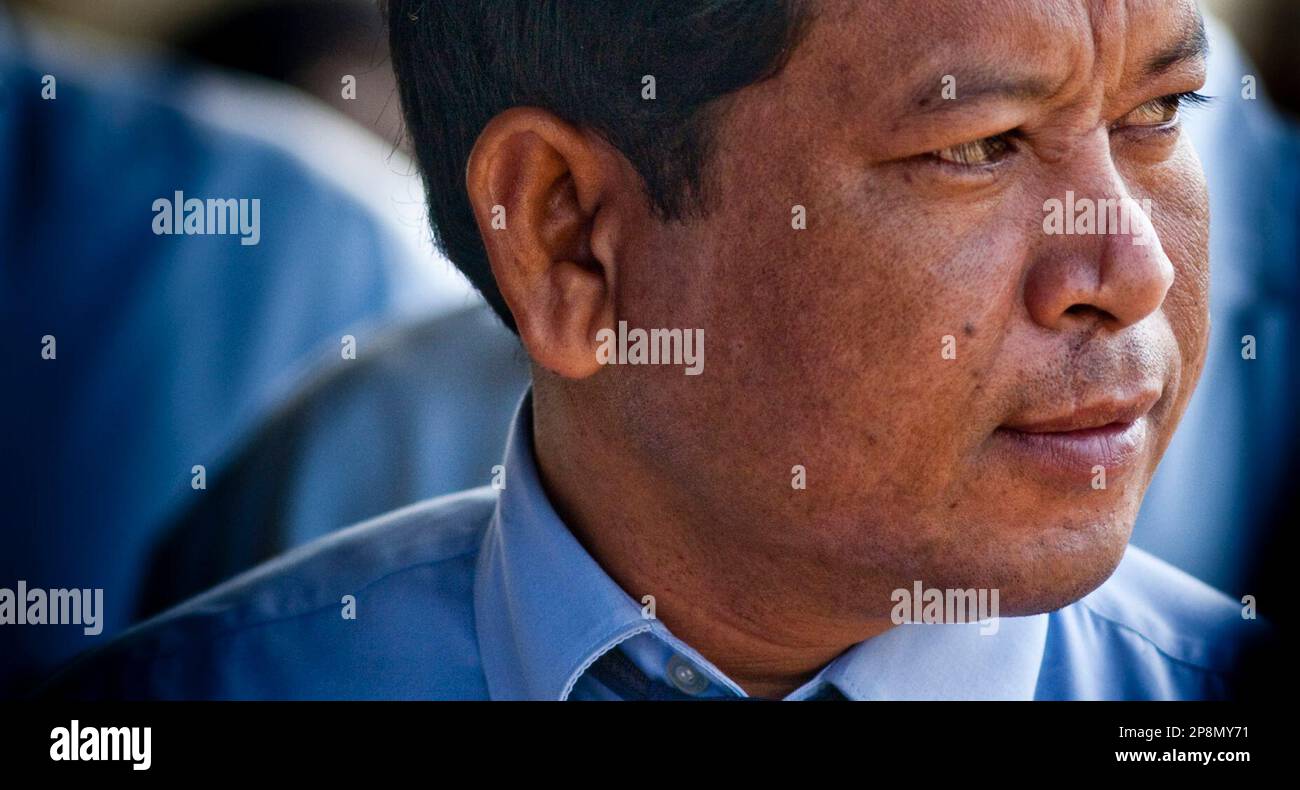 A Cambodian looks on while waiting to enter into the Extraordinary ...