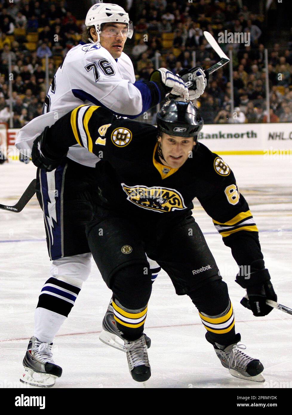 Boston Bruins right wing Byron Bitz (61) hinders Tampa Bay Lightning ...
