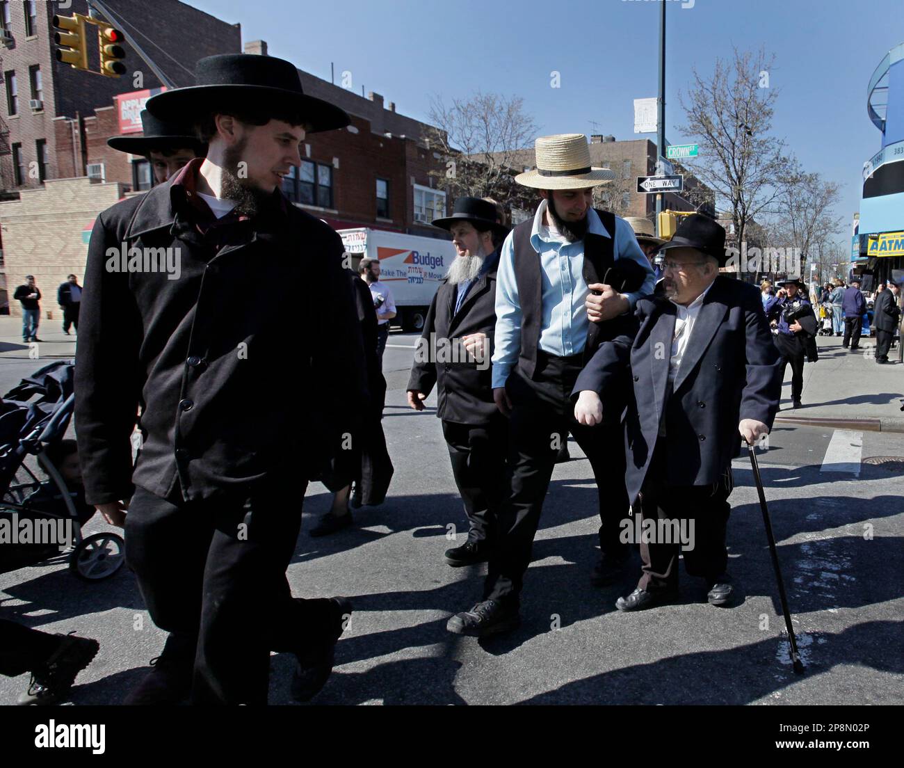 Aaron Lapp, left, and Elmer Fisher, second from right, exchange looks ...