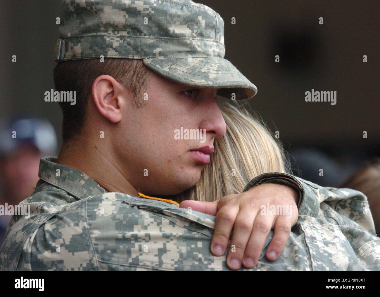 Dillon Mitchell tightly hugs his girlfriend, Katelyn Partee, before ...