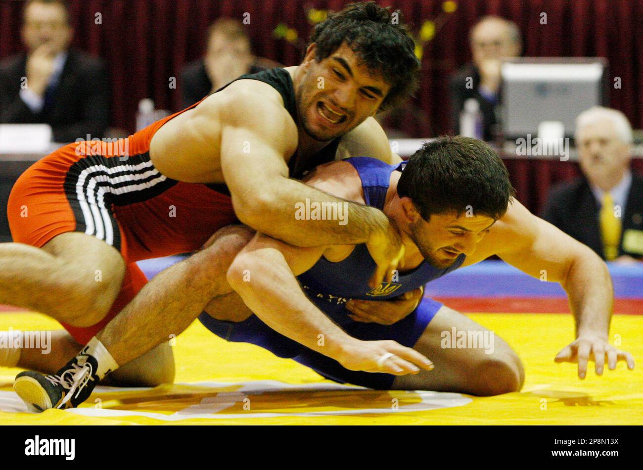 Russian Soslan Ktsoev, red, grapples with Ukrainian Ibragim Aldatov in ...
