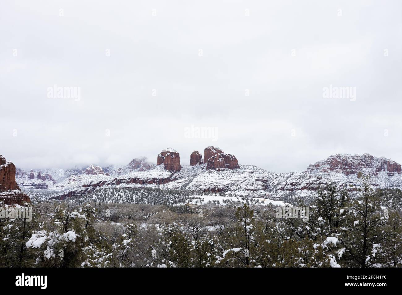 Scenic view of beautiful red rocks covered in snow in Sedona, Arizona ...