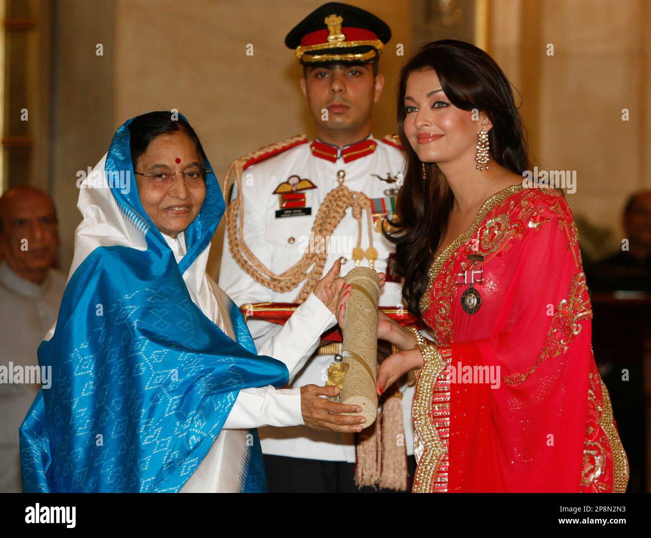 Indian President Pratibha Patil presents the Padma Shri award, one of ...