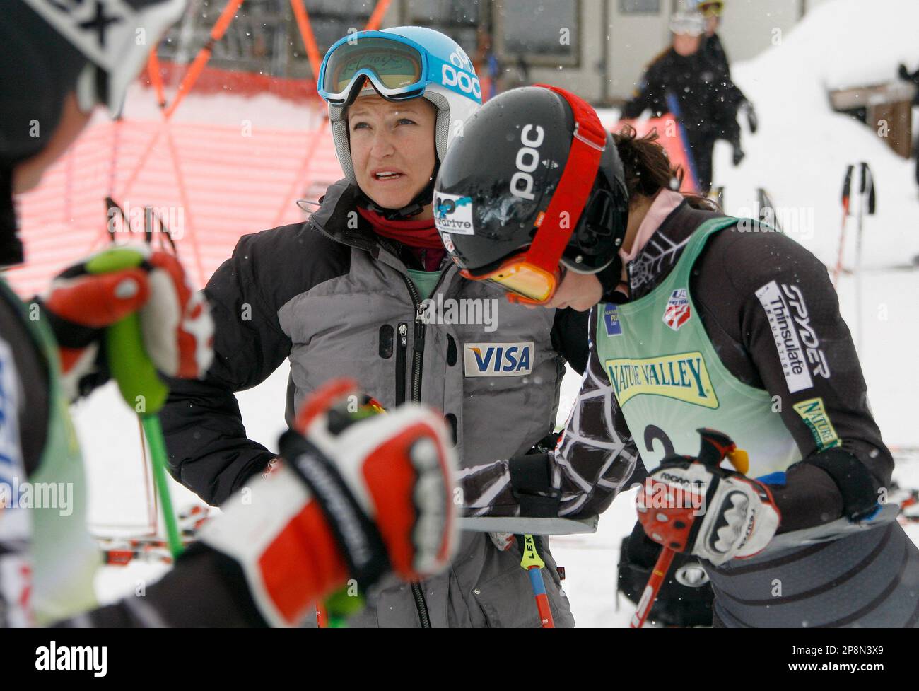 Julia Mancuso, left, watches the other skiers with Megan McJames after ...