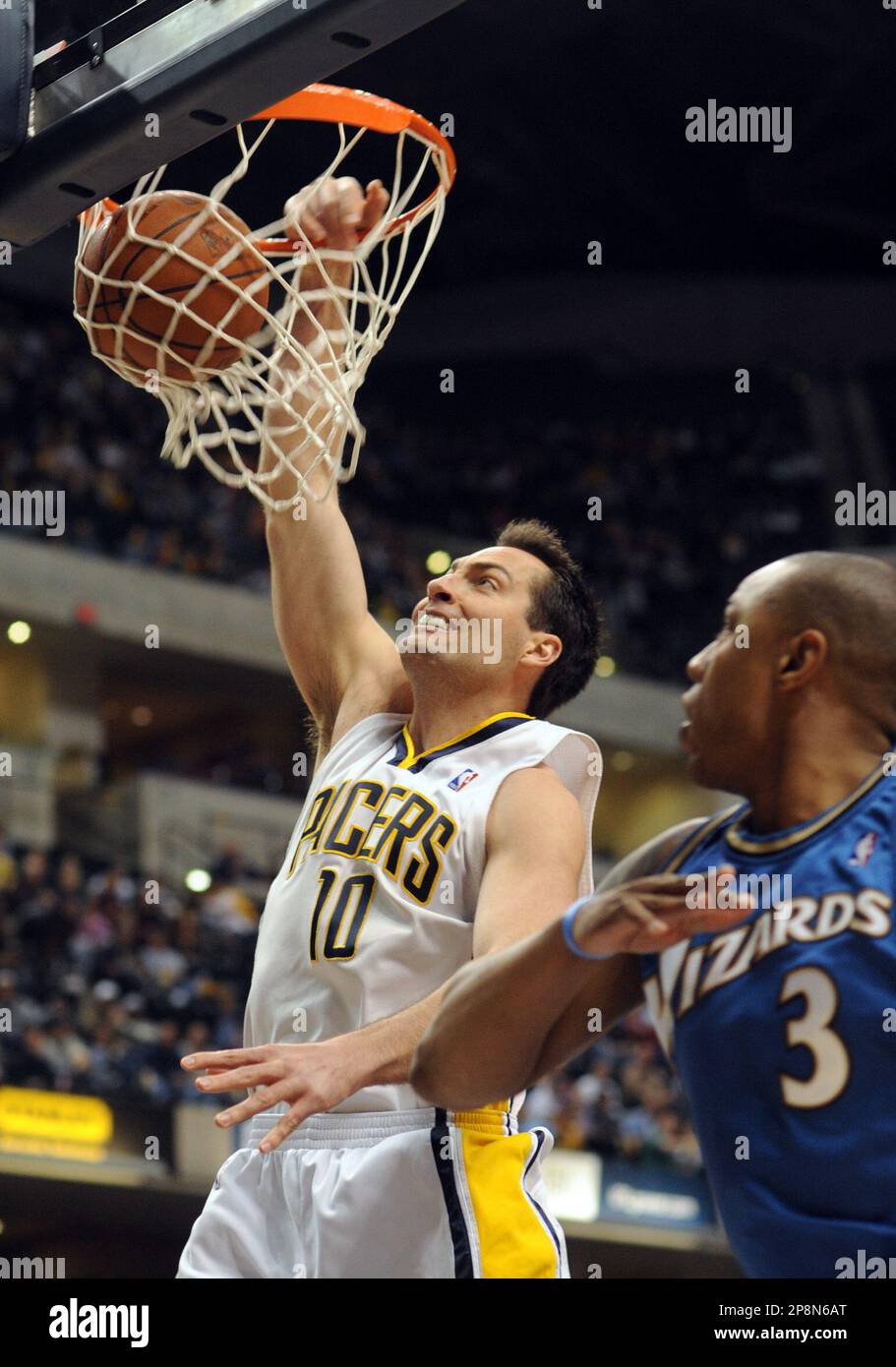Indiana Pacers center Jeff Foster dunks next to Washington Wizards ...