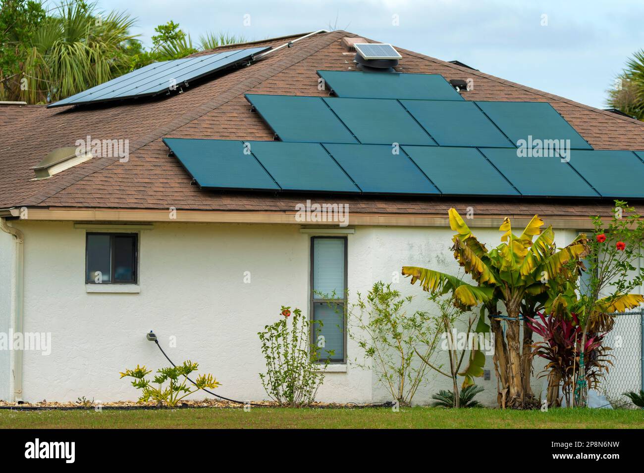 Ordinary residential house in USA with rooftop covered with solar ...
