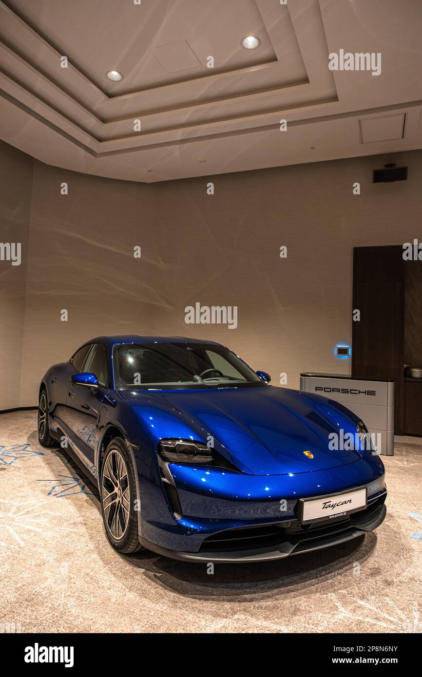 Circa 2023 - Sofia, Bulgaria: A blue shiny new Porsche Tacan car on ...