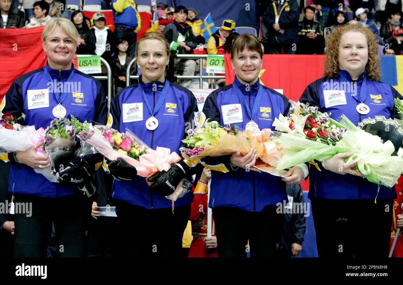 Sweden's players, from left, Anette Norberg, Eva Lund, Cathrine Lindahl ...