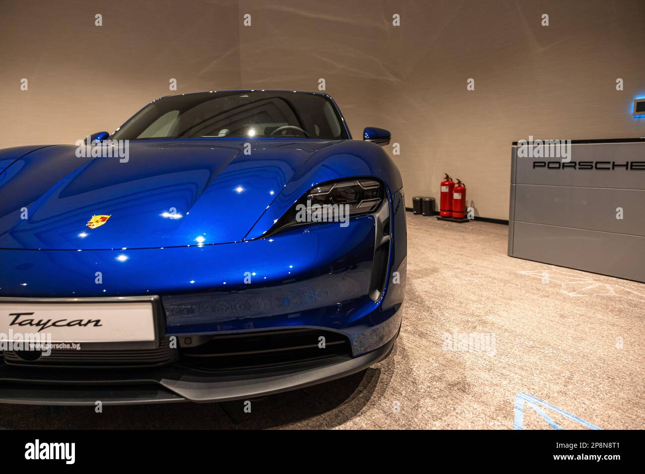 Circa 2023 - Sofia, Bulgaria: A blue shiny new Porsche Tacan car on ...