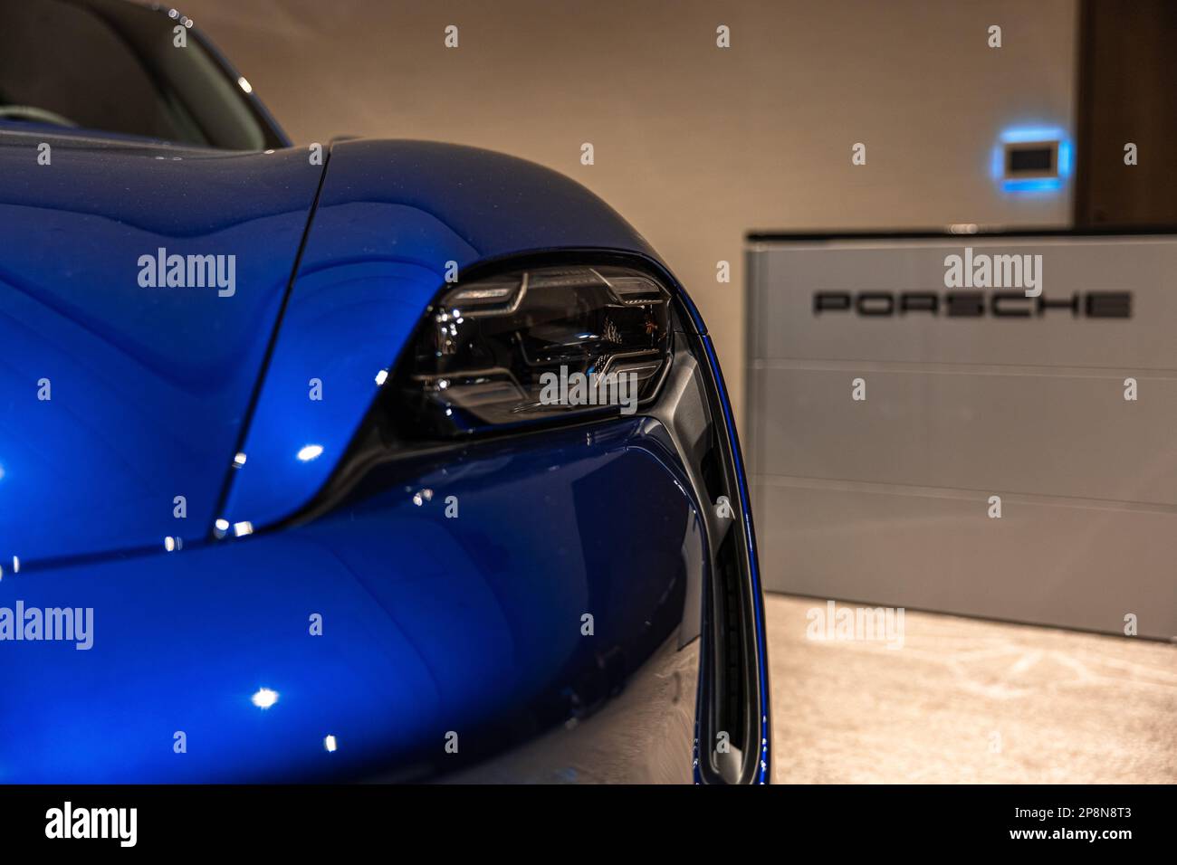 Circa 2023 - Sofia, Bulgaria: A blue shiny new Porsche Tacan car on ...