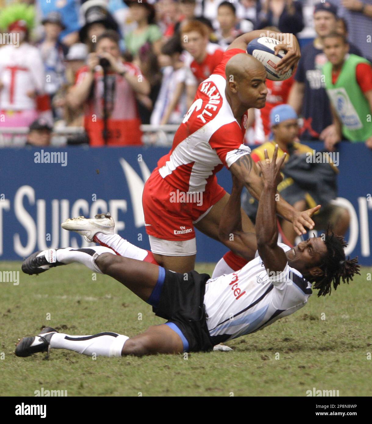 Tom Varndell of England, top, is tackled by Nasoni Roko of Fiji during ...