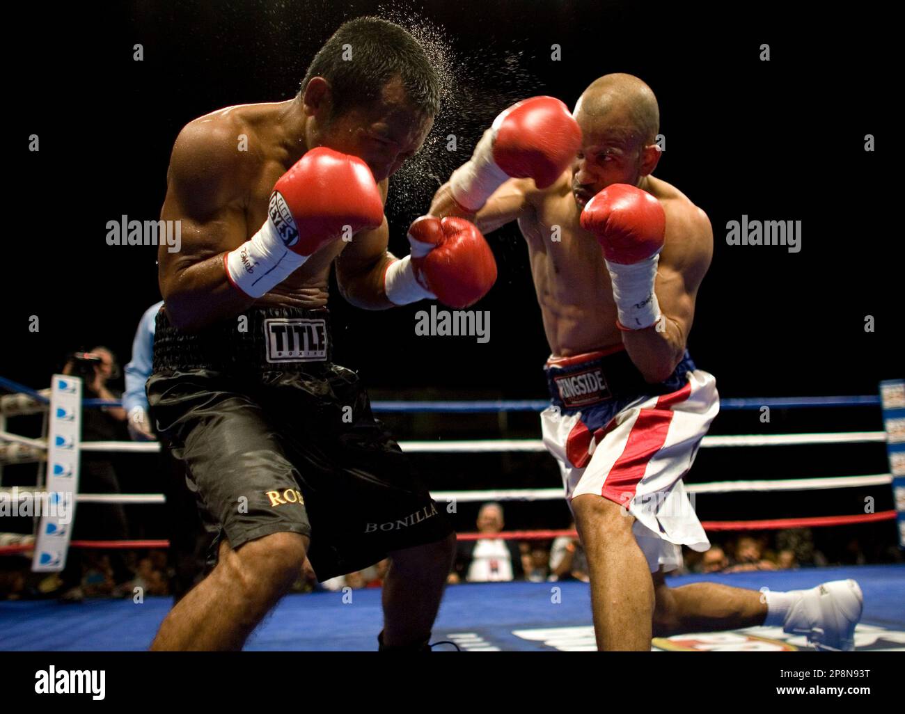 Puerto Rico's Eric Morel, right, lands a right hook to the head of ...