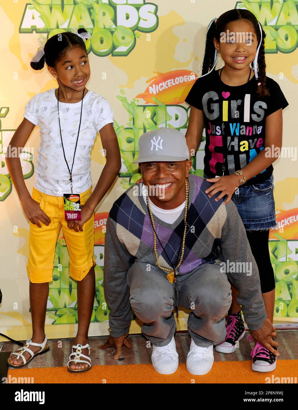 Russell Simmons, center, with daughters Aoki Simmons, left, and Ming ...
