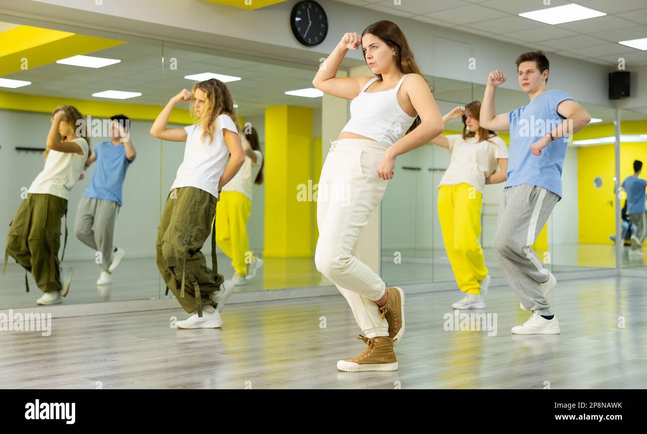Young girl training breakdance Toprock moves in dance hall Stock Photo ...