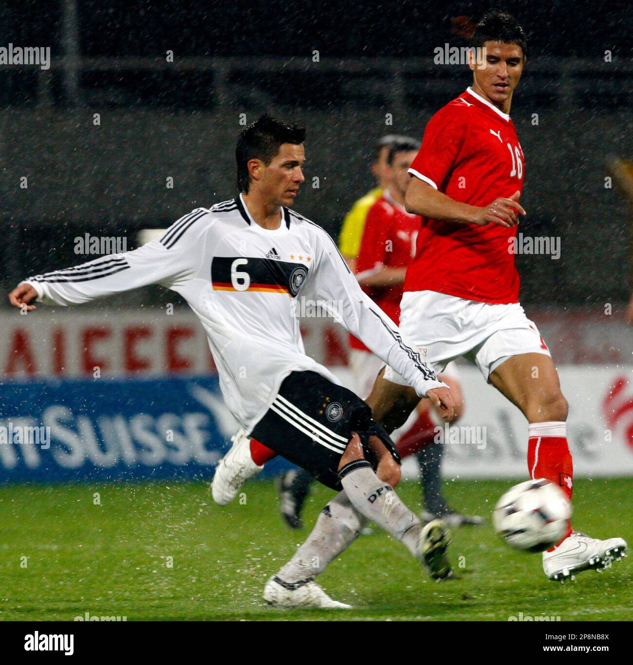German Danny Latza, left, and Swiss Simone Grippo, right, fight for the ...