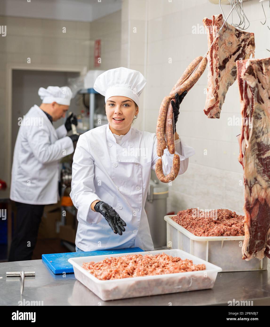 Butcher uniform cutting ribs hi-res stock photography and images - Alamy
