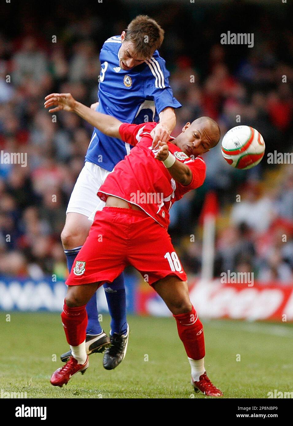 Wales' Robert Earnshaw, right, competes for the ball with Finland's ...