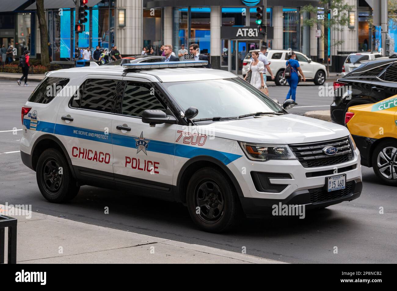 A Chicago Police car parked at a bustling intersection in the downtown ...