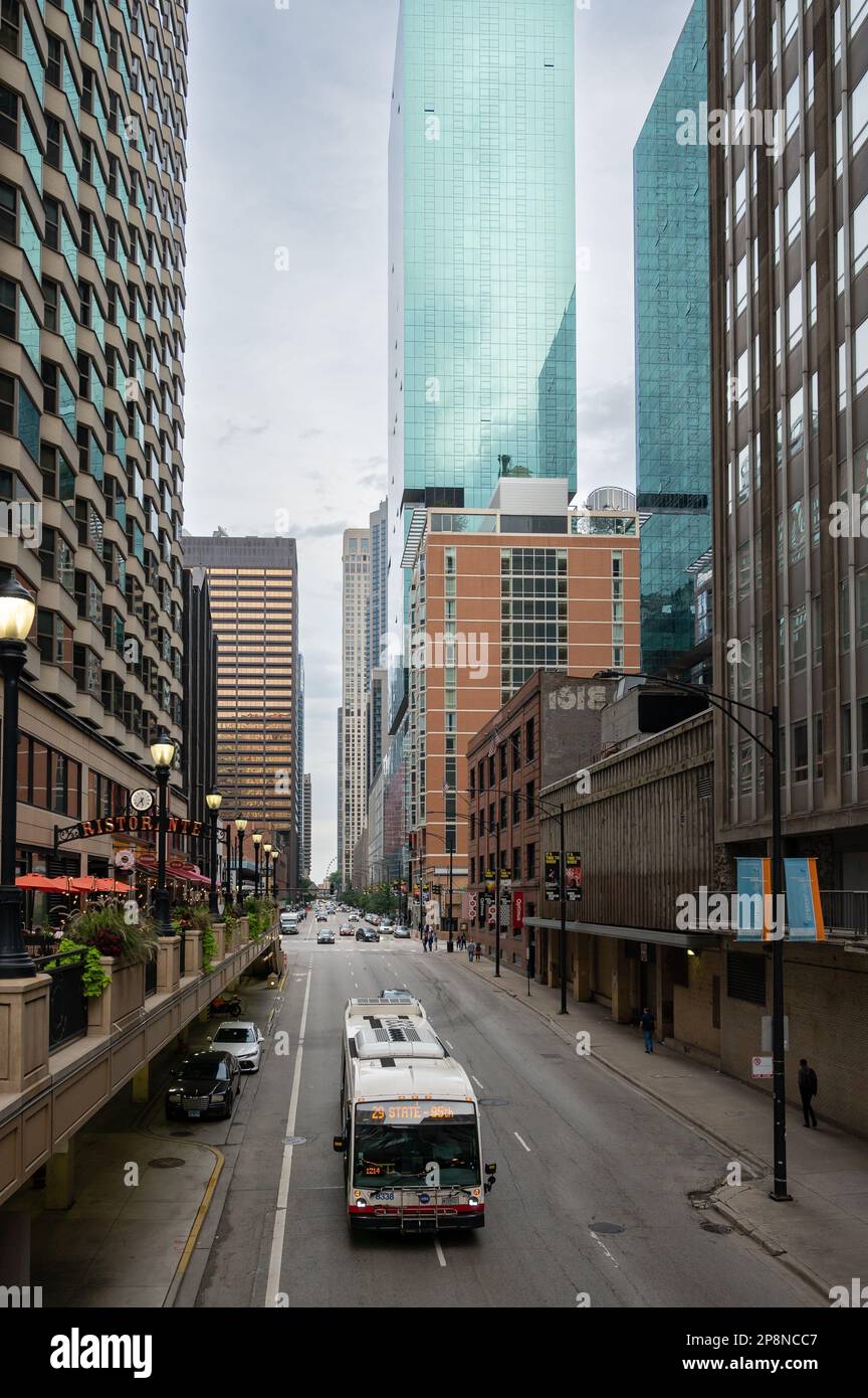 A vertical shot of a bustling urban cityscape, illuminated by the sun ...