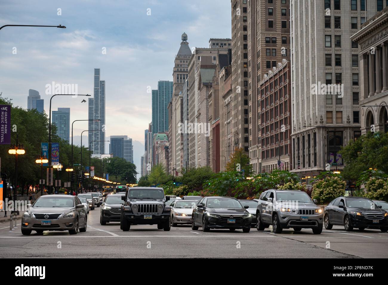A busy street in a cityscape on a cloudy day Stock Photo - Alamy