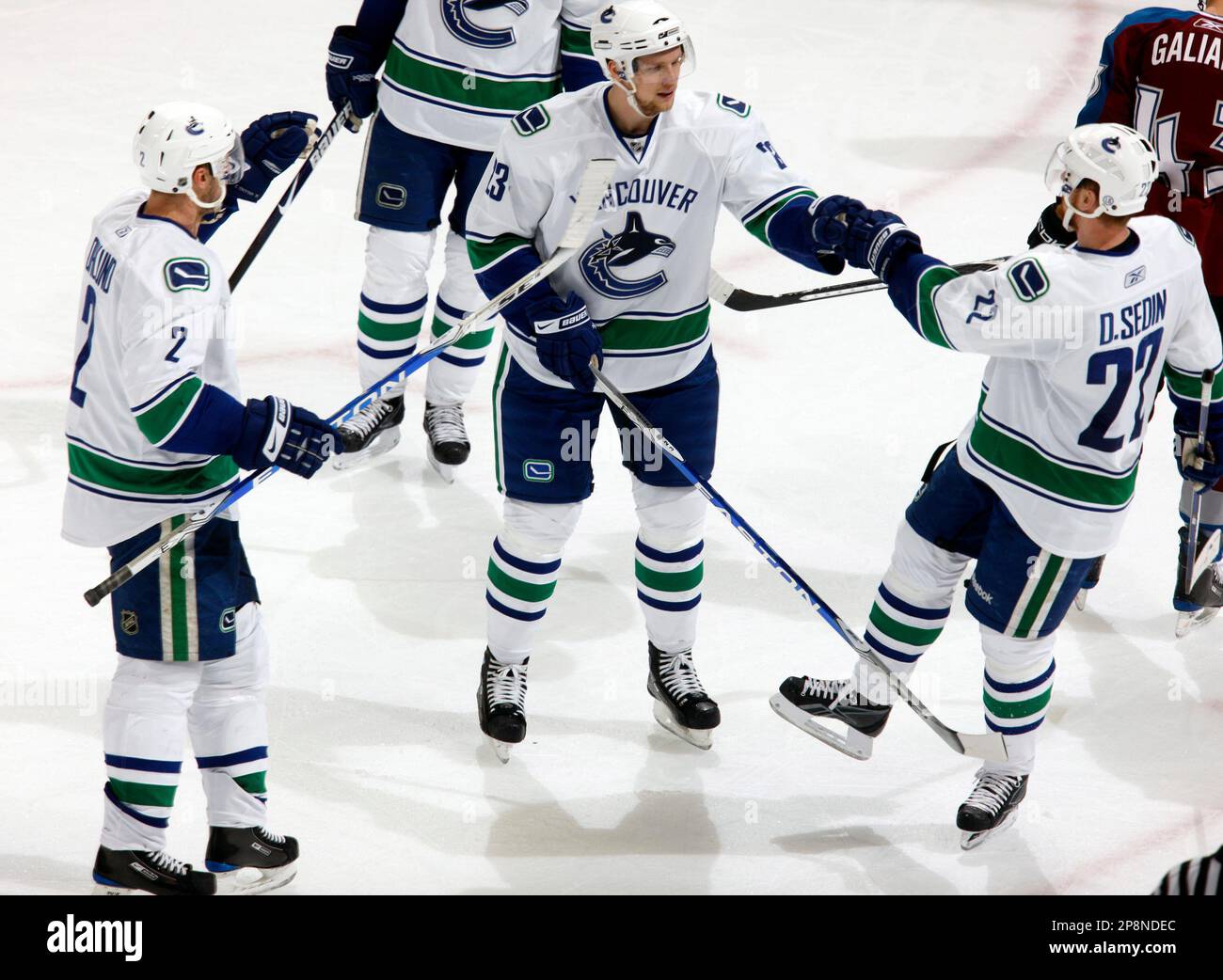 From left, Vancouver Canucks defenseman Mattias Ohlund celebrates a ...