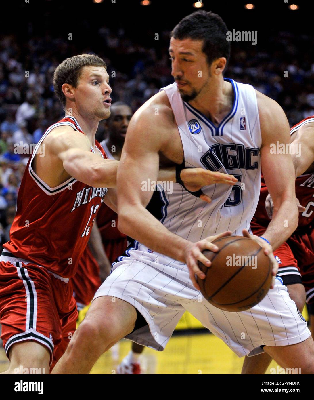 Orlando Magic forward Hedo Turkoglu, right, of Turkey, is defended by ...