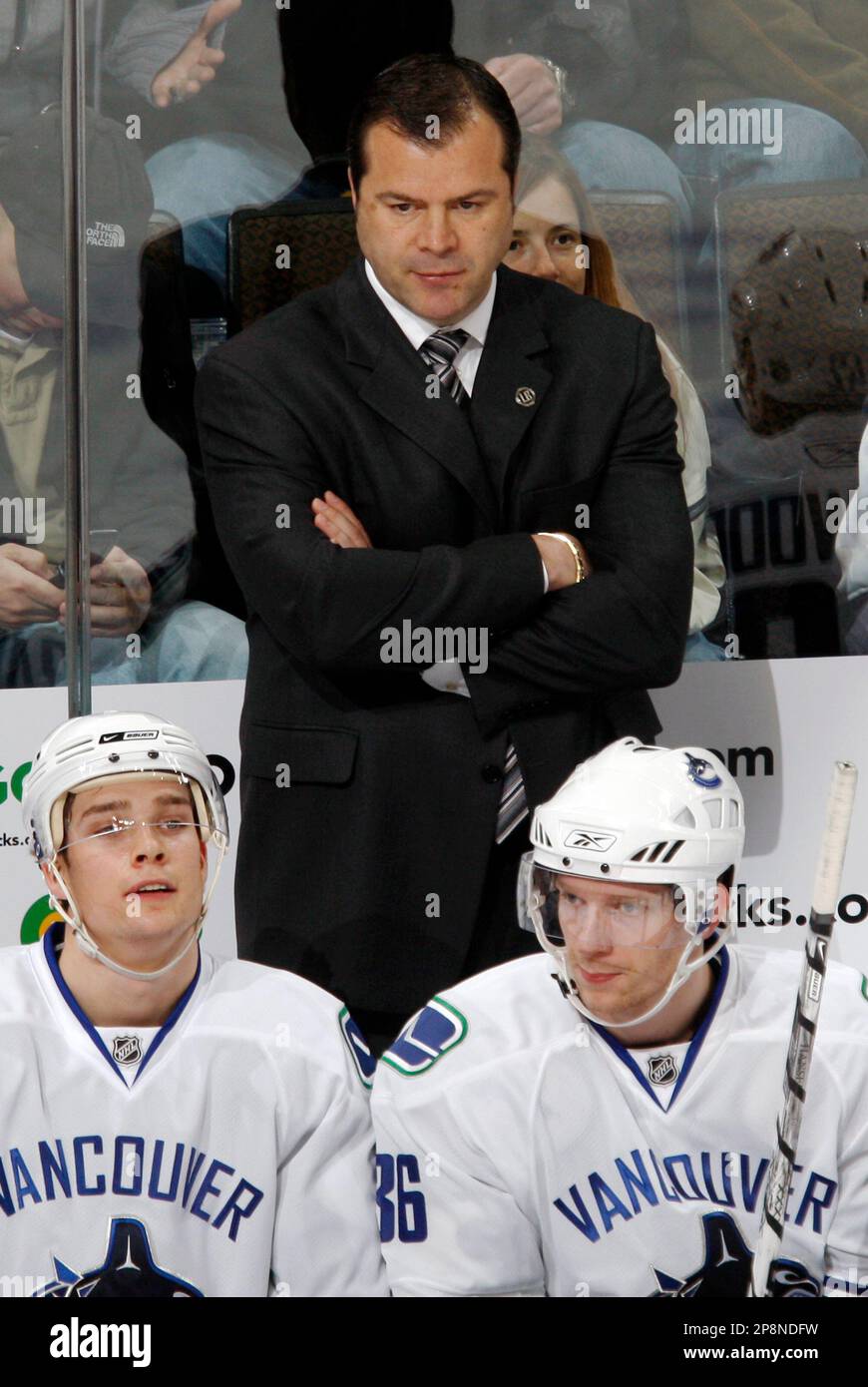 Vancouver Canucks head coach Alain Vigneault looks on against the ...