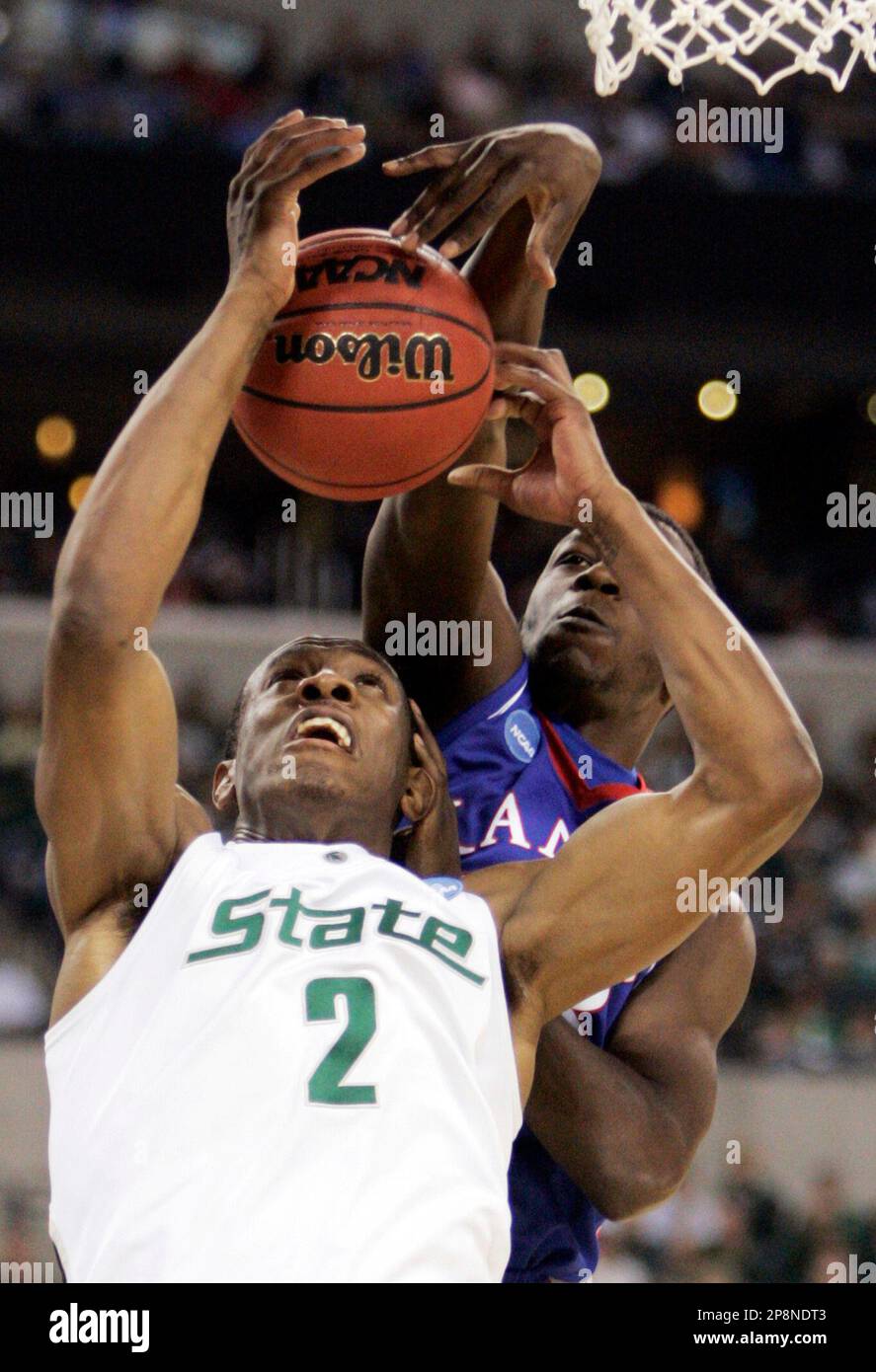Kansas' Mario Little blocks a shot by Michigan State's Raymar Morgan ...