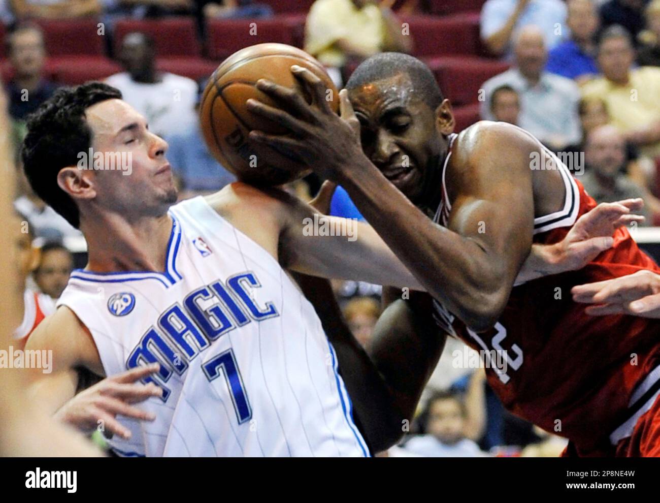 Orlando Magic guard J.J. Redick (7) and Milwaukee Bucks forward Luc ...