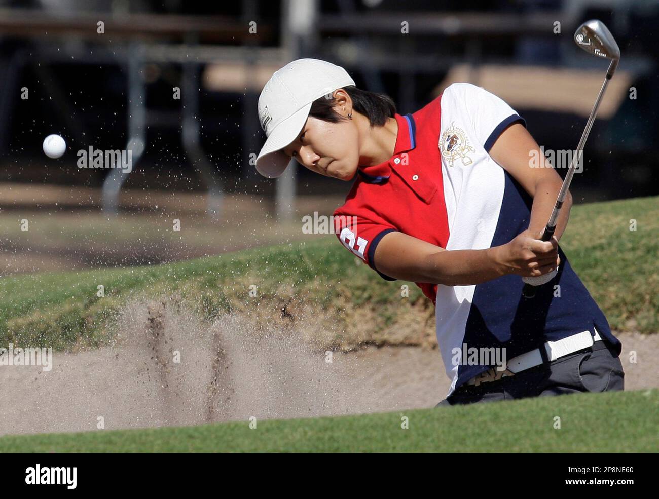Song-Hee Kim, of South Korea, hits out of a green side bunker at the ...
