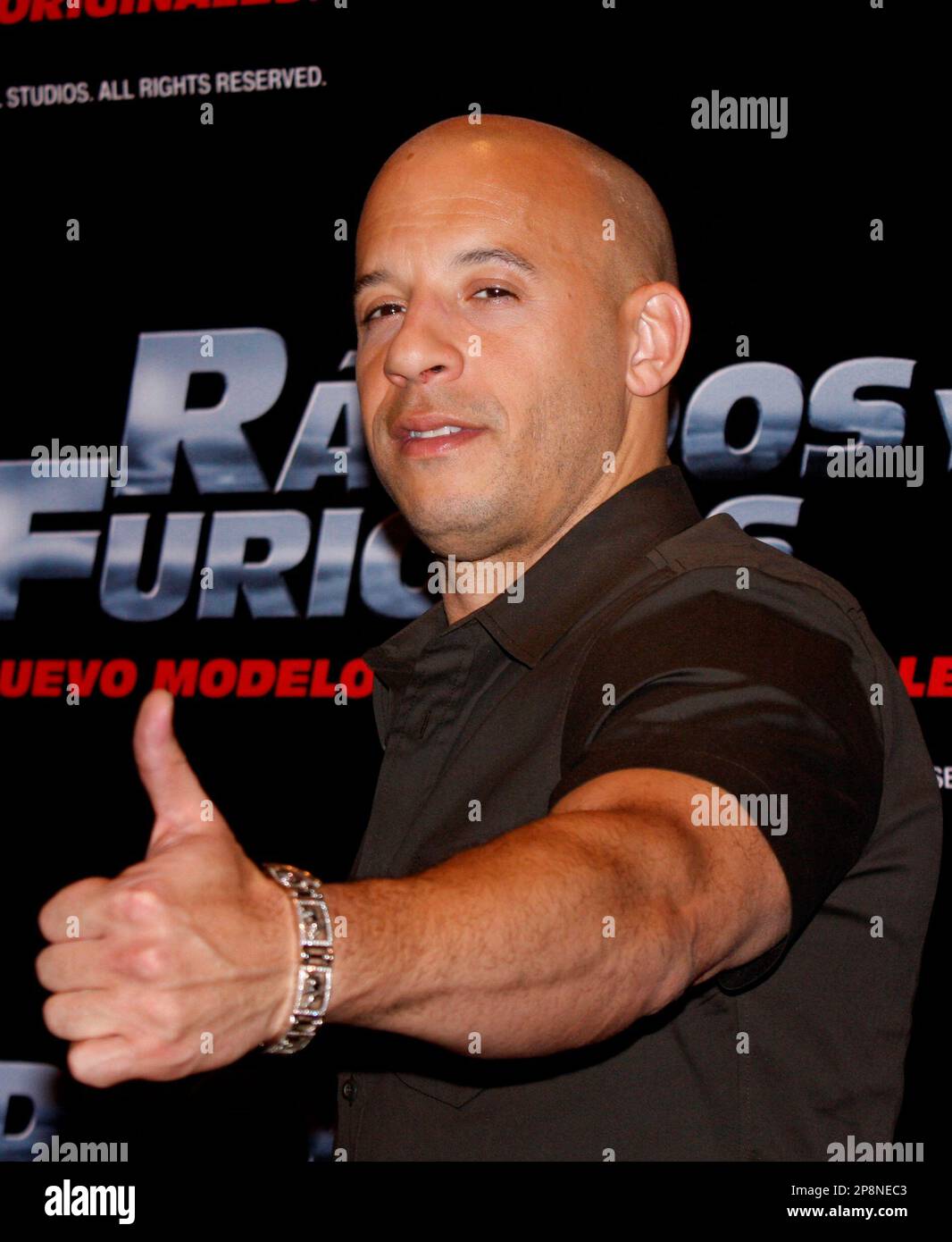U.S. actor Vin Diesel gestures as he poses for photographers during an ...