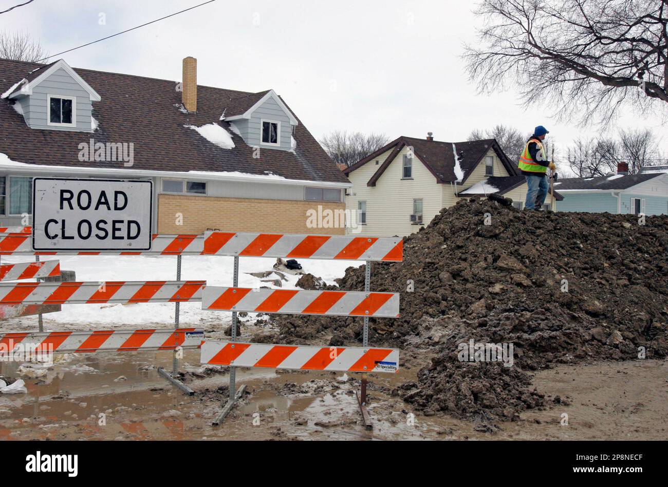 Jon Knecht, right, checks the height atop a newly constructed earthen ...
